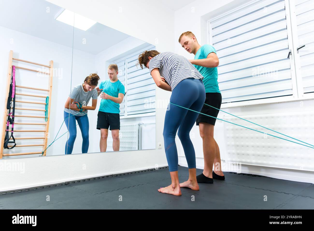 Woman with shoulder pain in physical therapy. Physical therapist ...