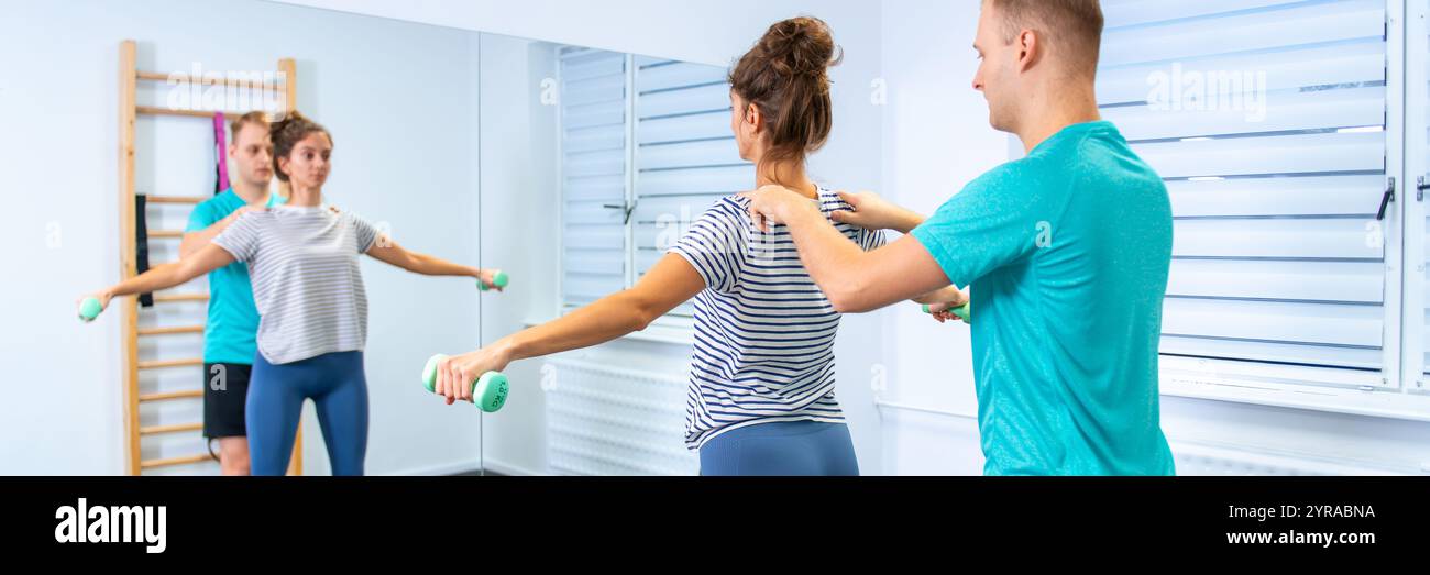 Woman with shoulder pain in physical therapy. Physical therapist ...