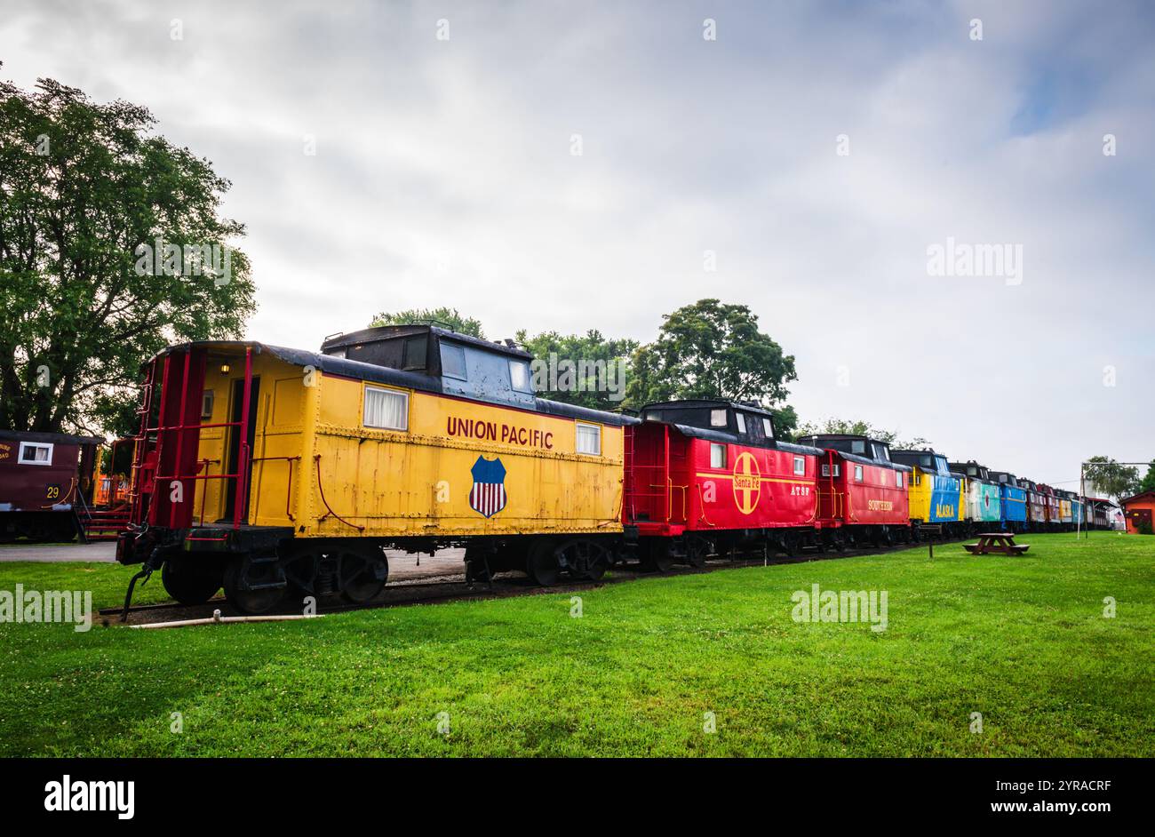 Multiple colorful rail cars converted in hotel accomodations at the ...