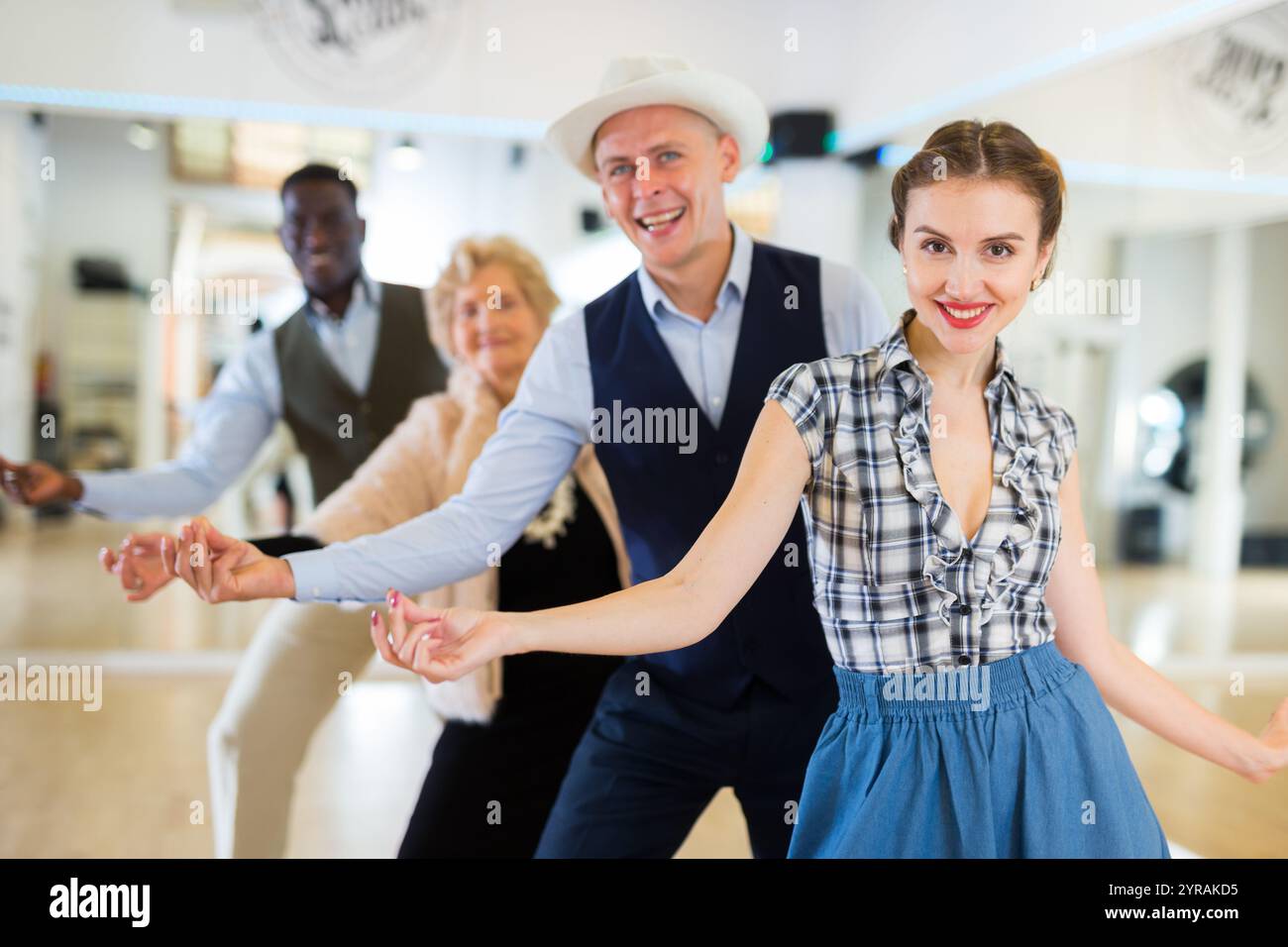 Group of different age dancers preparing swing performance Stock Photo ...