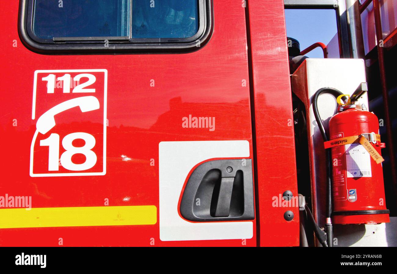 Fire brigade intervention. Vehicles with emergency telephone numbers on ...