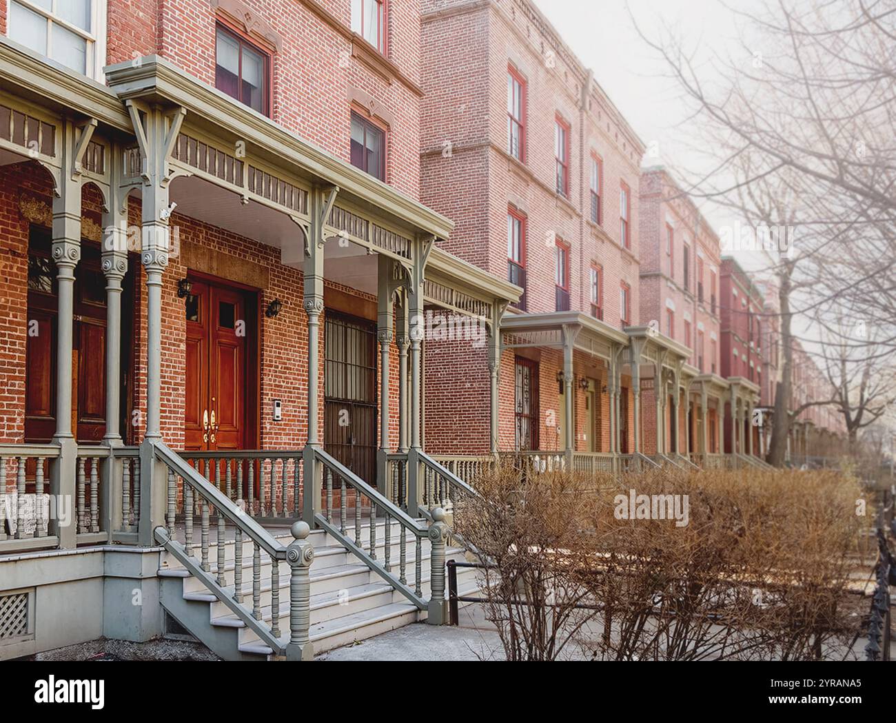Row of brick buildings. The buildings have a classic old-fashioned look ...