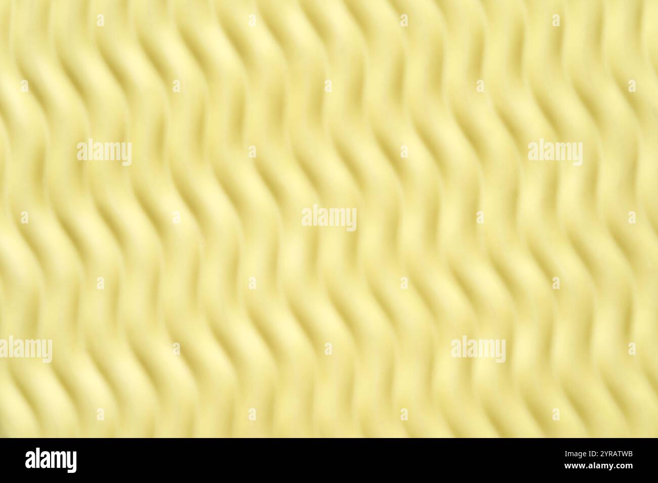 Abstract yellow wavy pattern background with textured surface and ...