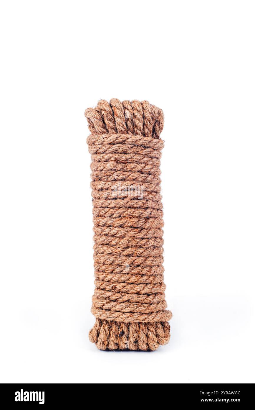 a coil of jute rope standing on a white background Stock Photo - Alamy