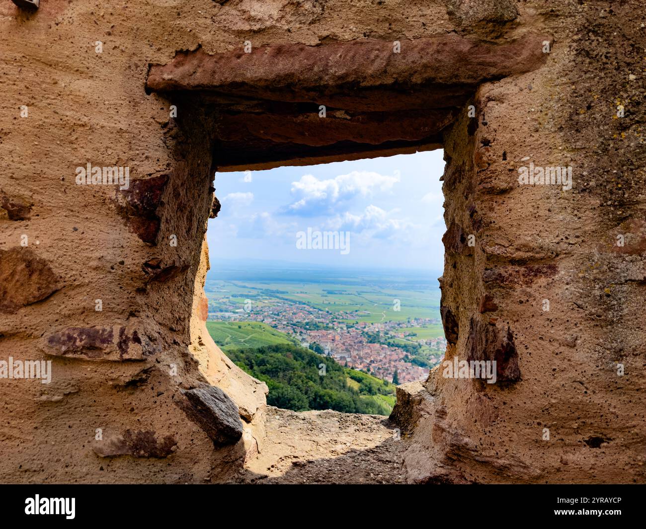 Ancient stone frame reveals a panoramic view of Eguisheim town Stock ...