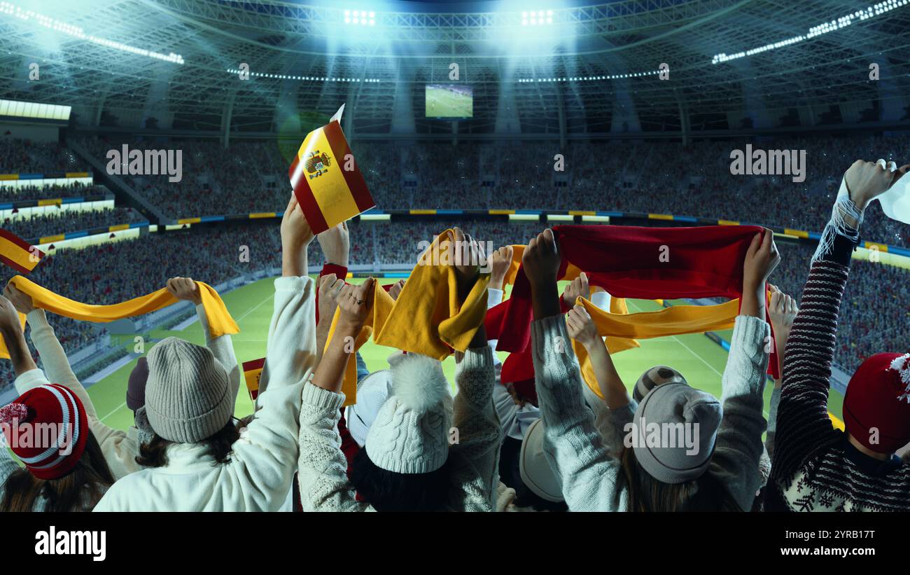 Group of sports fans dressed in warm winter clothes, passionately ...