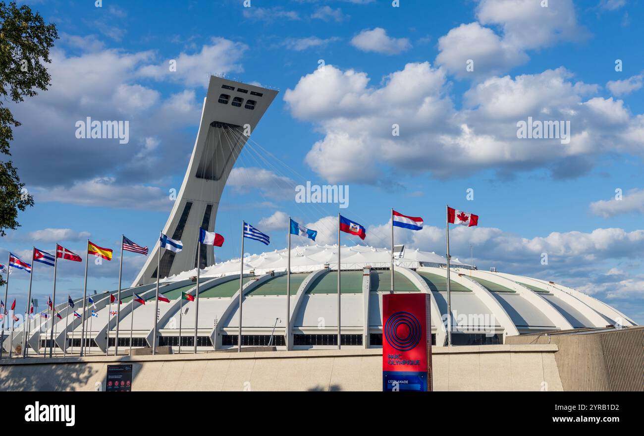 Montreal Olympic Stadium (The Big O) with flags of the world. Montreal ...