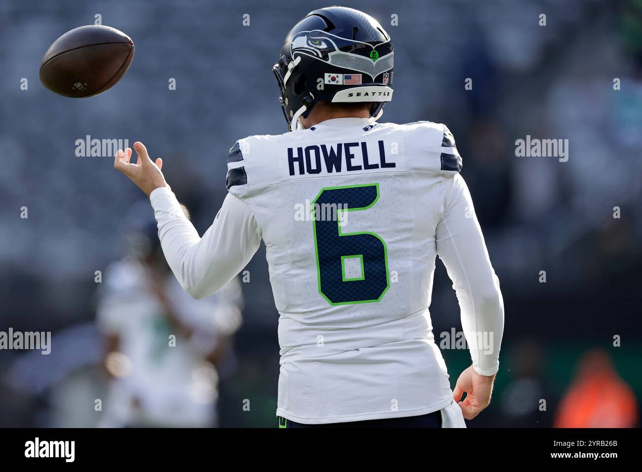 Seattle Seahawks quarterback Sam Howell (6) warms up with a flag decal ...