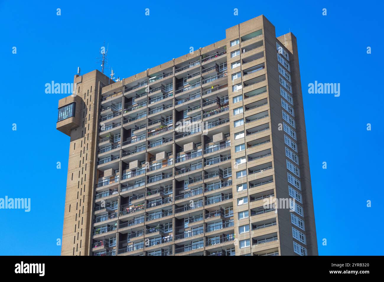 A Brutalist style tower block, Trellick Tower, in London against a ...