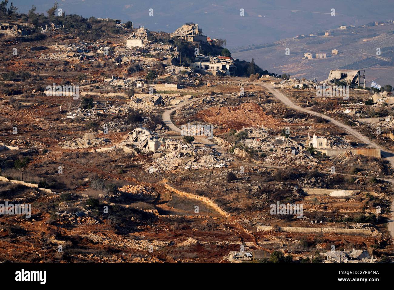 Destroyed buildings in the village of Kfar Kila, southern Lebanon, are ...