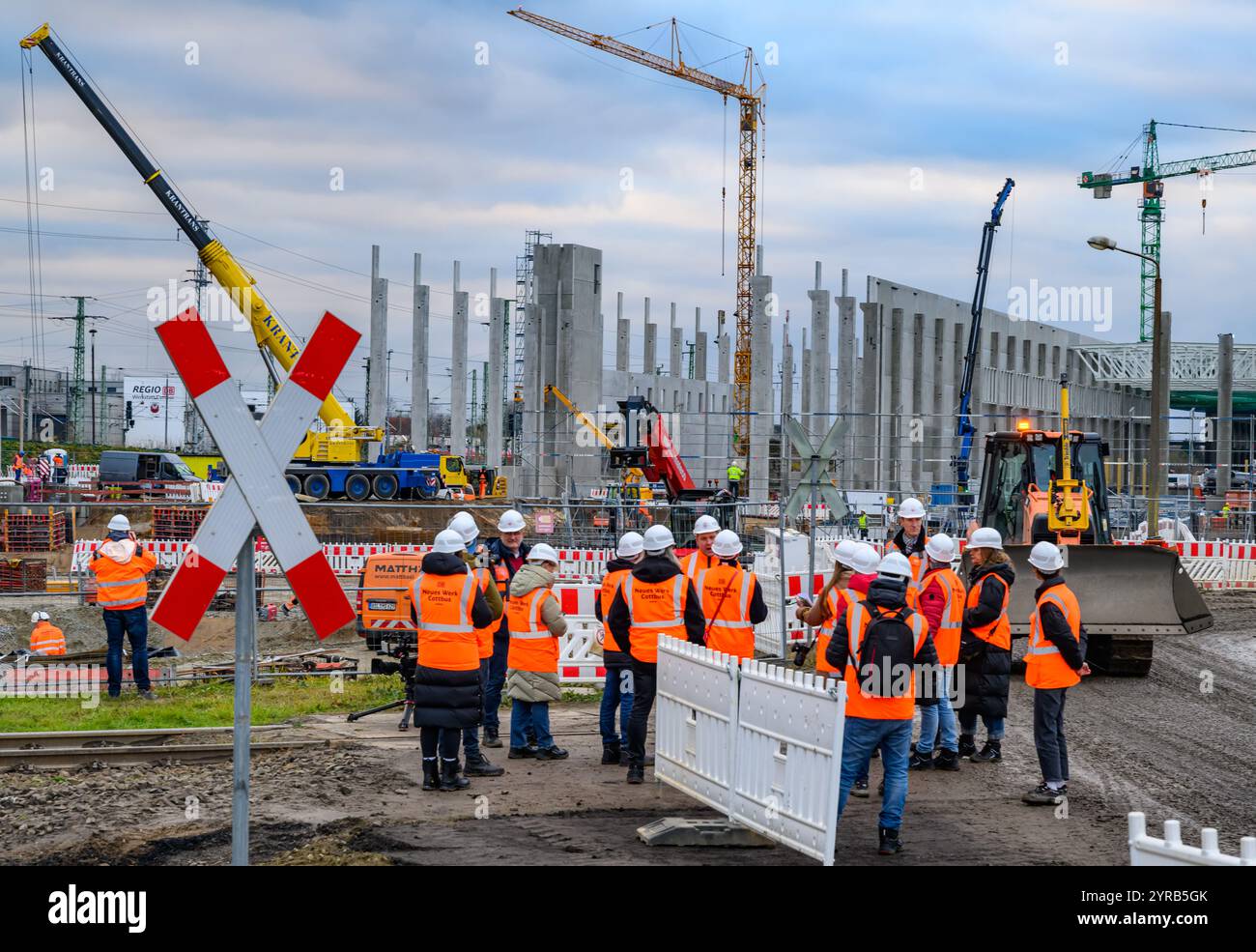 Cottbus, Germany. 03rd Dec, 2024. Journalists stand on the construction ...
