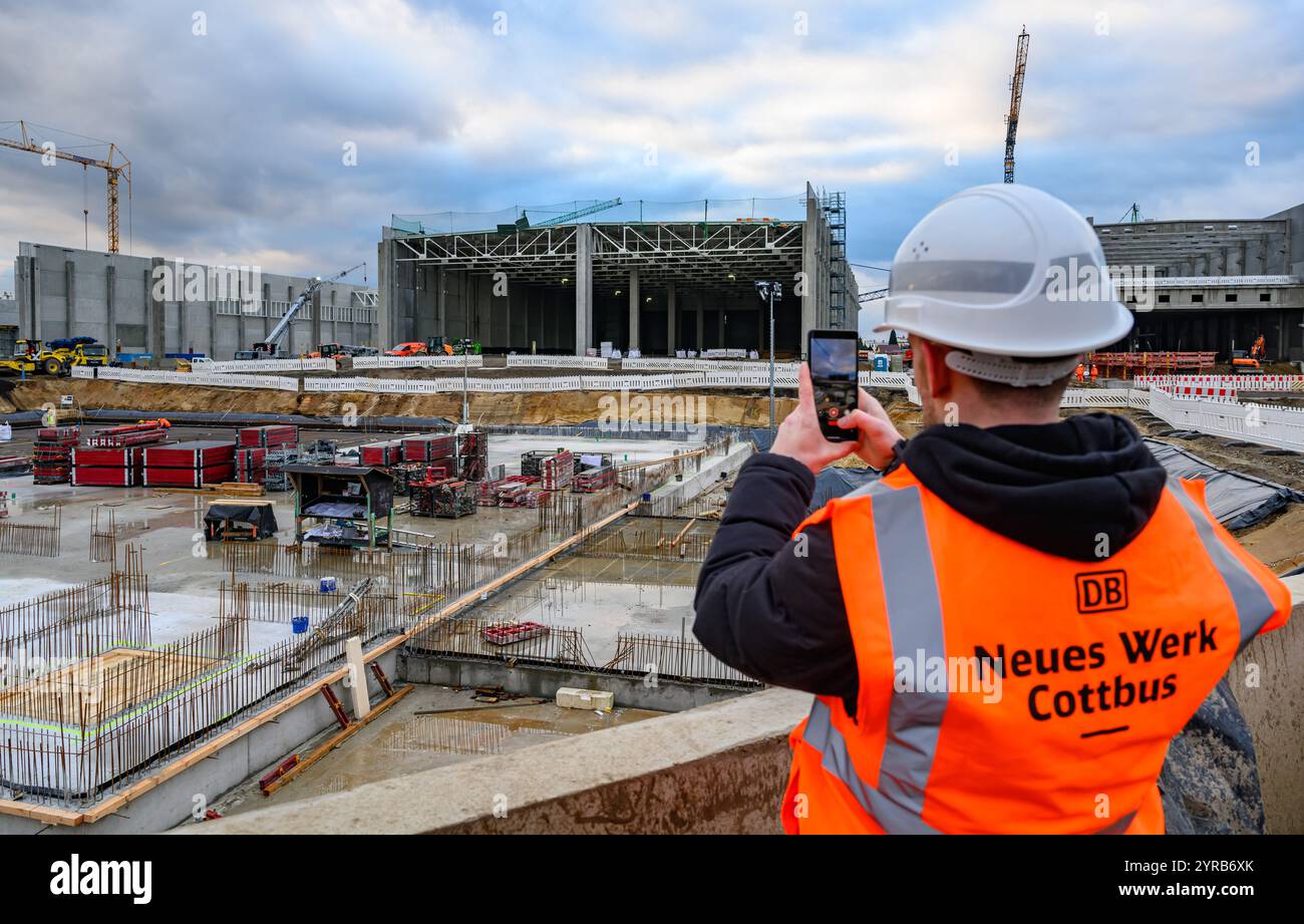 Cottbus, Germany. 03rd Dec, 2024. A journalist stands on the ...