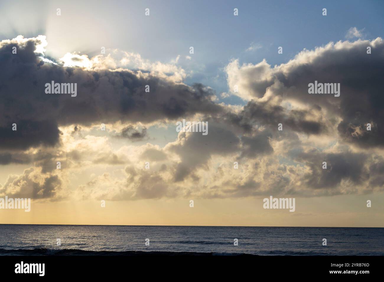 Breathtaking sunrise sun hiding hi-res stock photography and images - Alamy