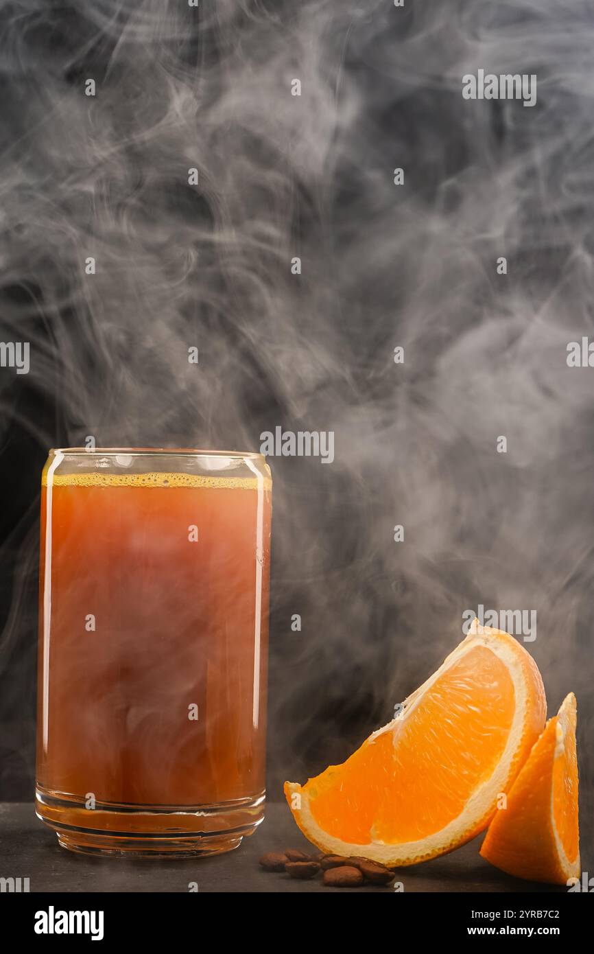 The bright orange shades of the juice contrast sharply with the rich ...