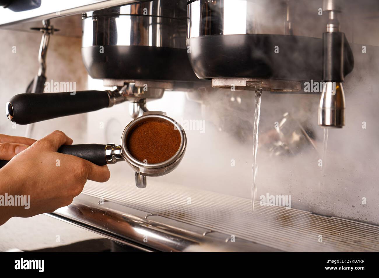 Professional brewing, coffee bar details. Espresso coffee pouring from ...