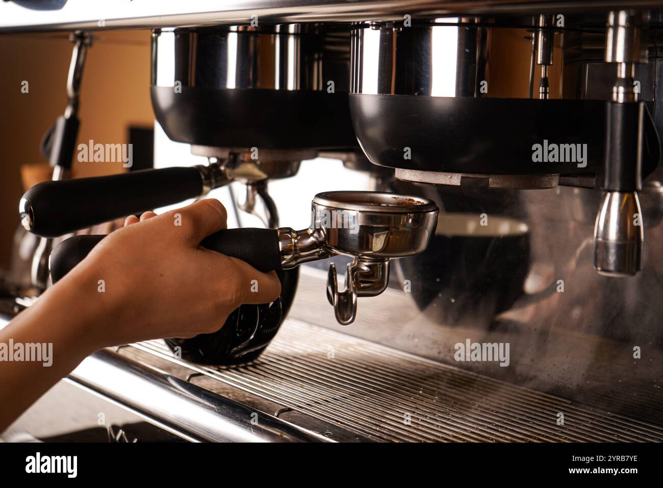 The barista is already eager to make coffee. With the help of a coffee ...