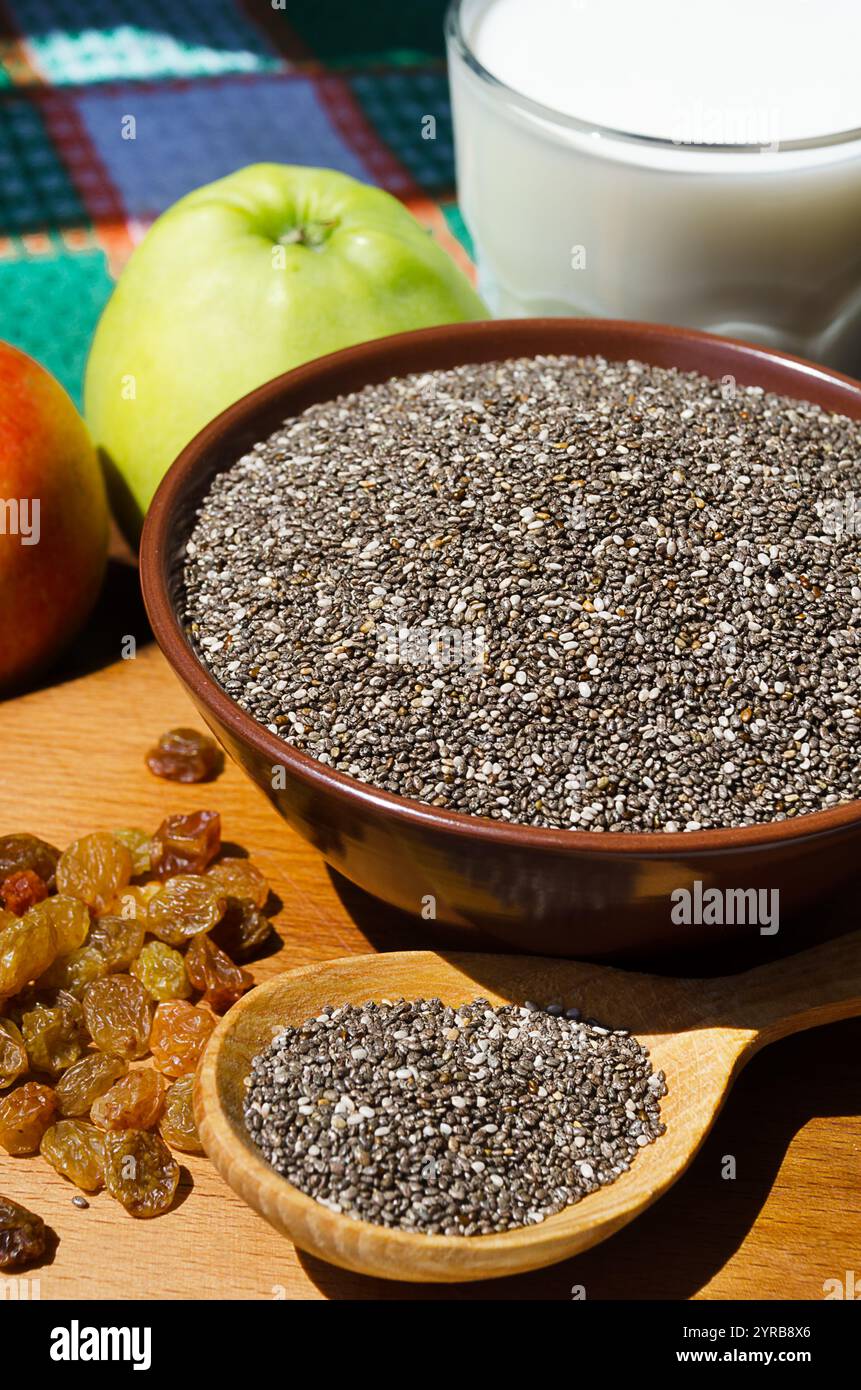 Chia in a bowl, raisins and yogurt. Chia is a plant of the Lamiaceae ...