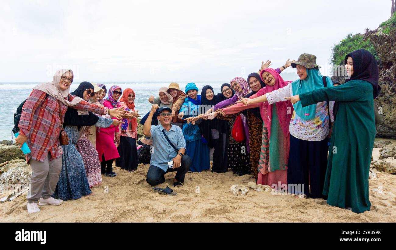 Some people vacation at Sadranan Beach. Sadranan is one of the beaches ...