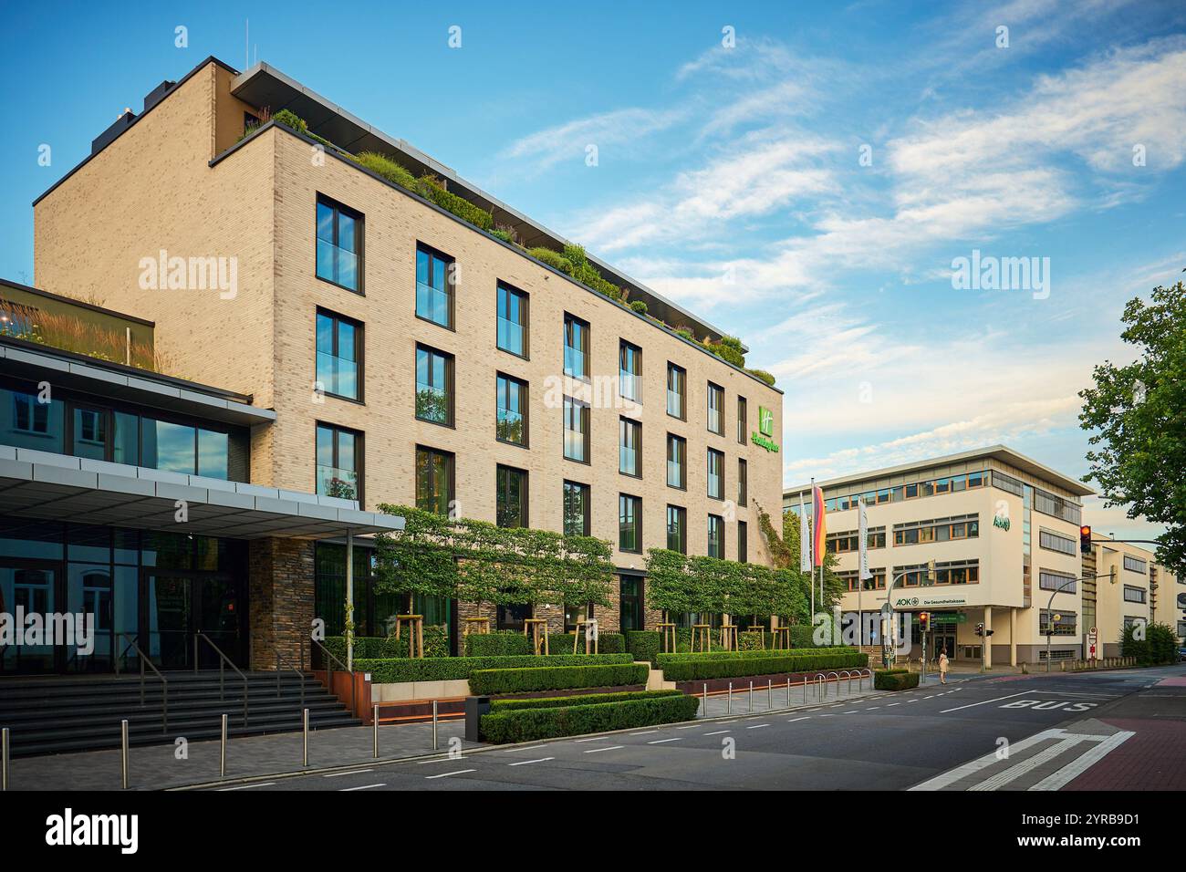 A modern hotel Holiday Inn building in Osnabruch, Germany, featuring a ...
