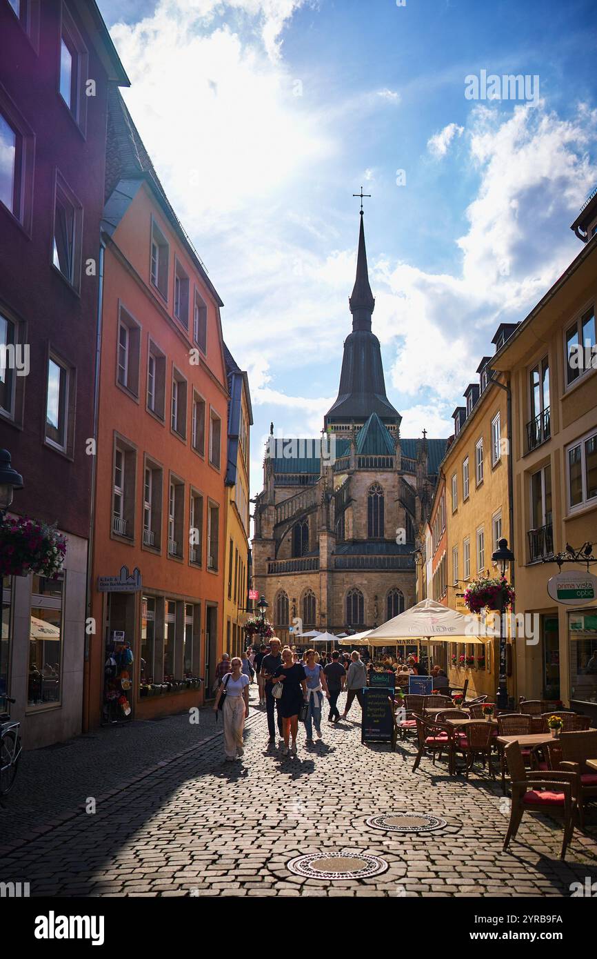 A vibrant street scene in Osnabruck, Germany, featuring colorful ...