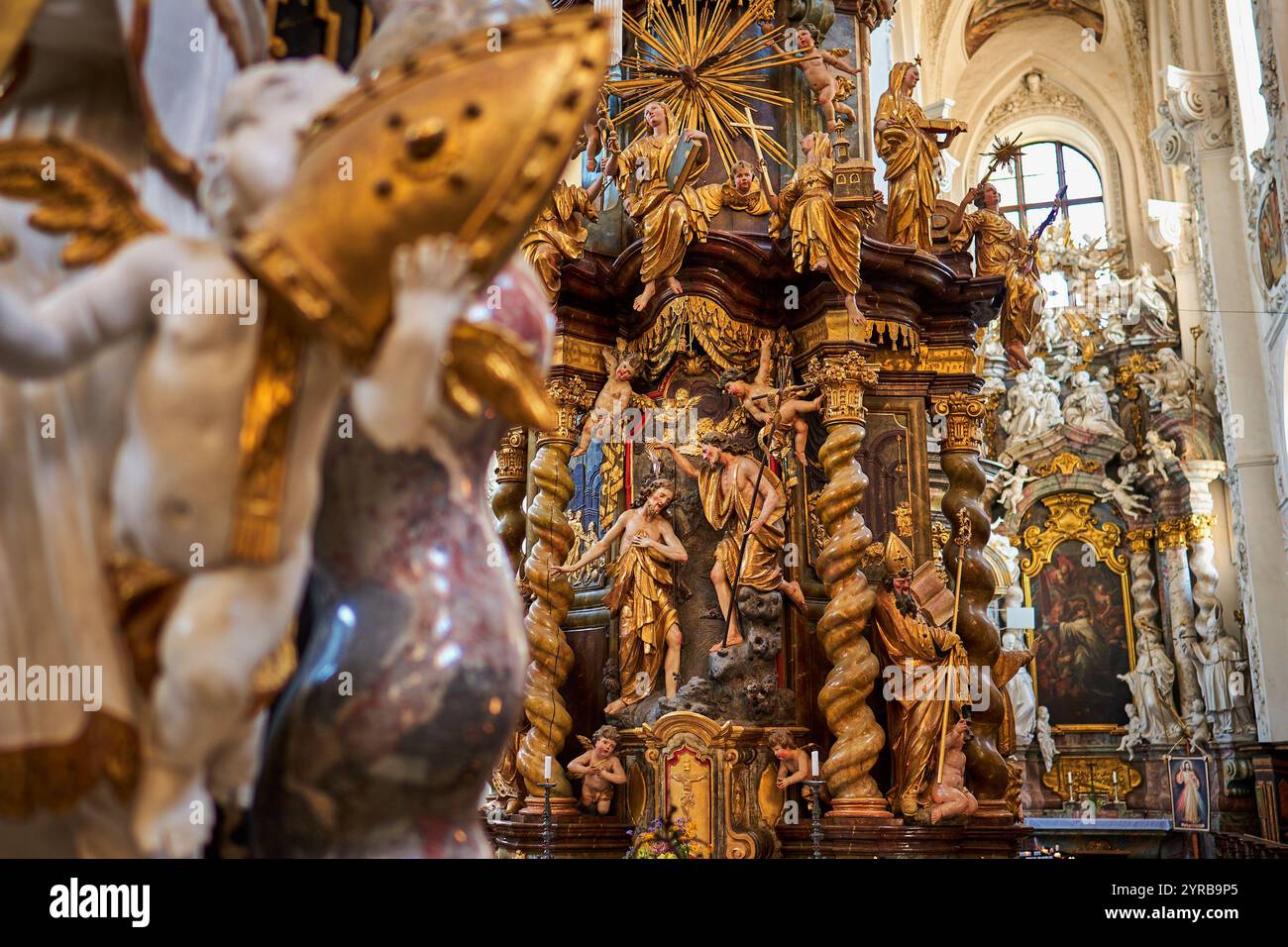 An ornate interior featuring intricate sculptures and religious figures ...
