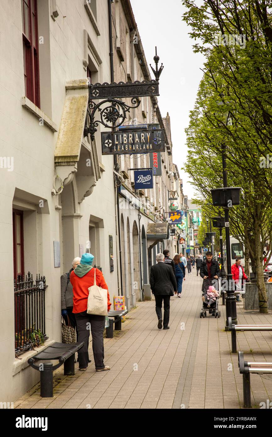 Ireland, County Mayo, Ballina, Pearse Street, people outside Library ...