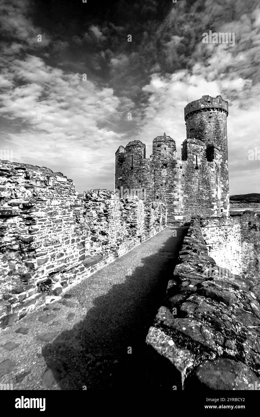 One of the broken towers of Conwy castle in black and white Stock Photo ...