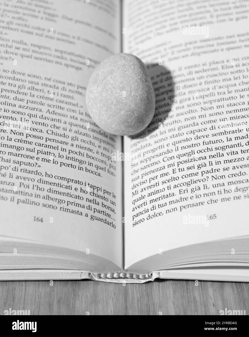 open book with stone bookmark Stock Photo - Alamy