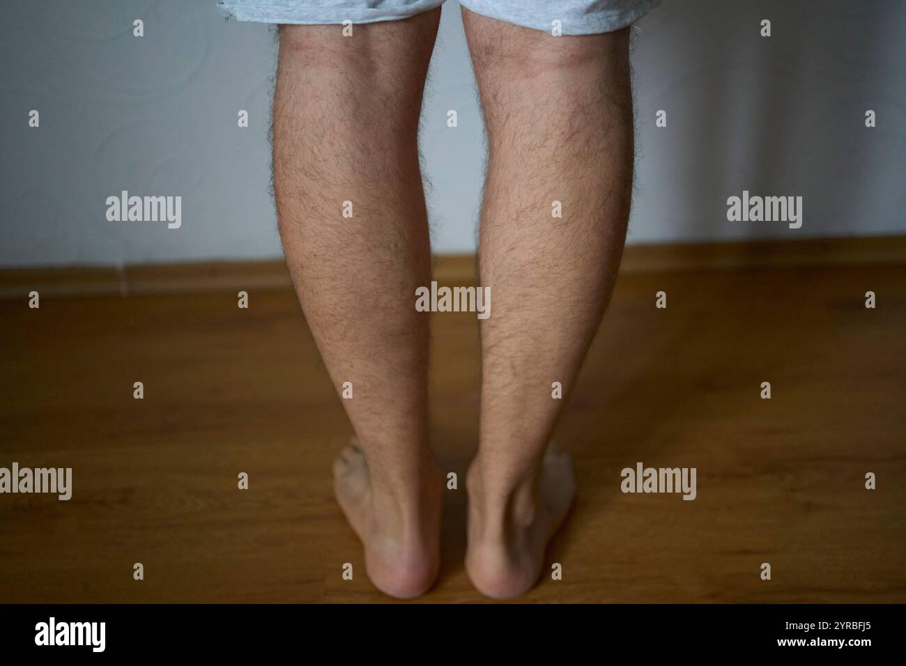 feet and calves of a man from behind Stock Photo - Alamy