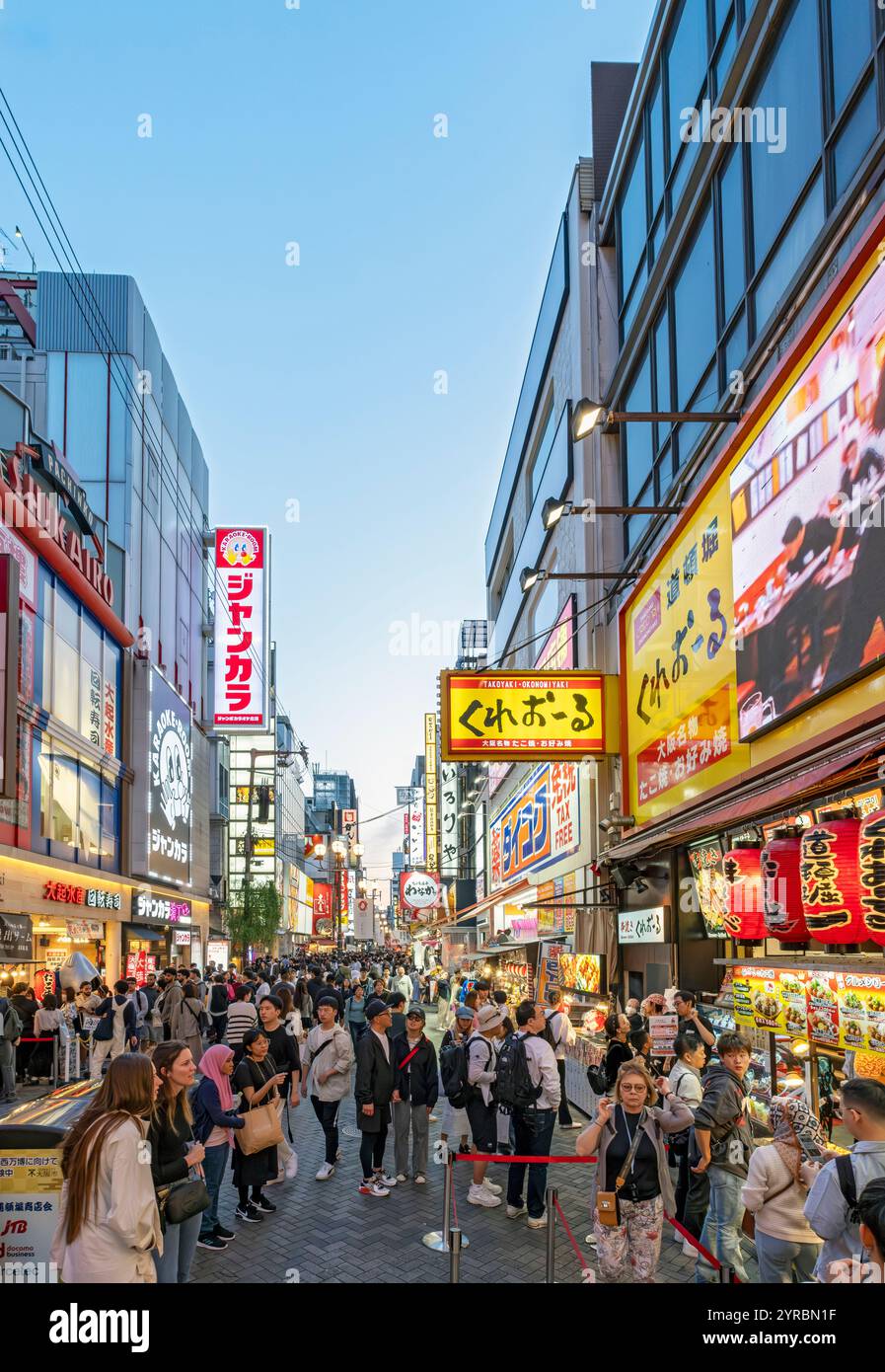 Night-time street with neon lights and illuminated signboards ...