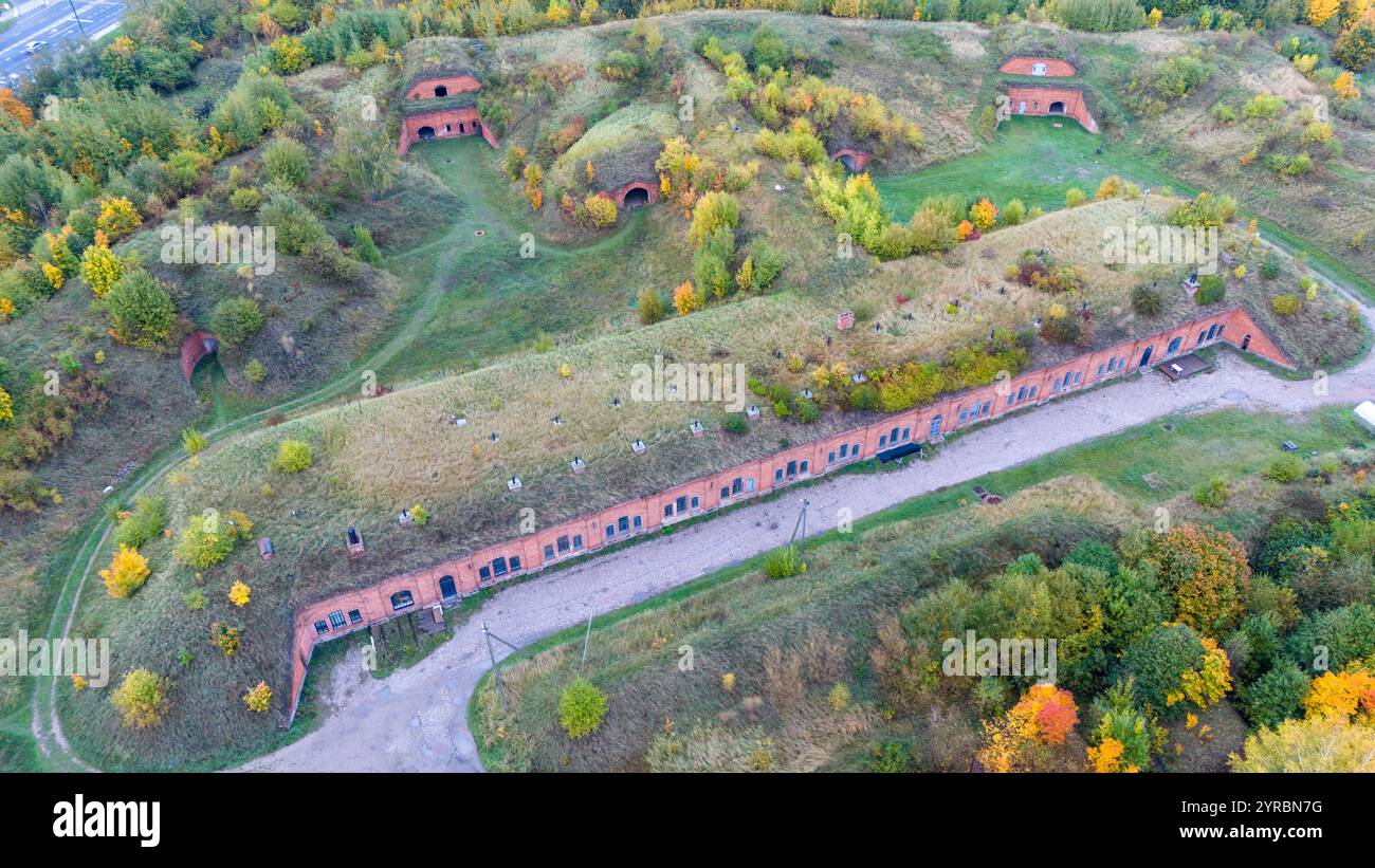 Aerial view of an old fort covered with grass and surrounded by autumn ...
