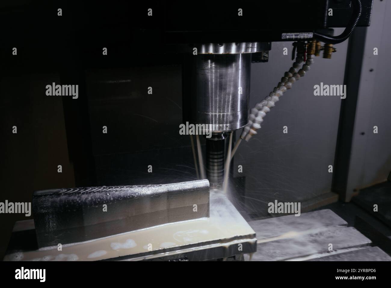 Milling machine with liquid coolant, close up Stock Photo - Alamy