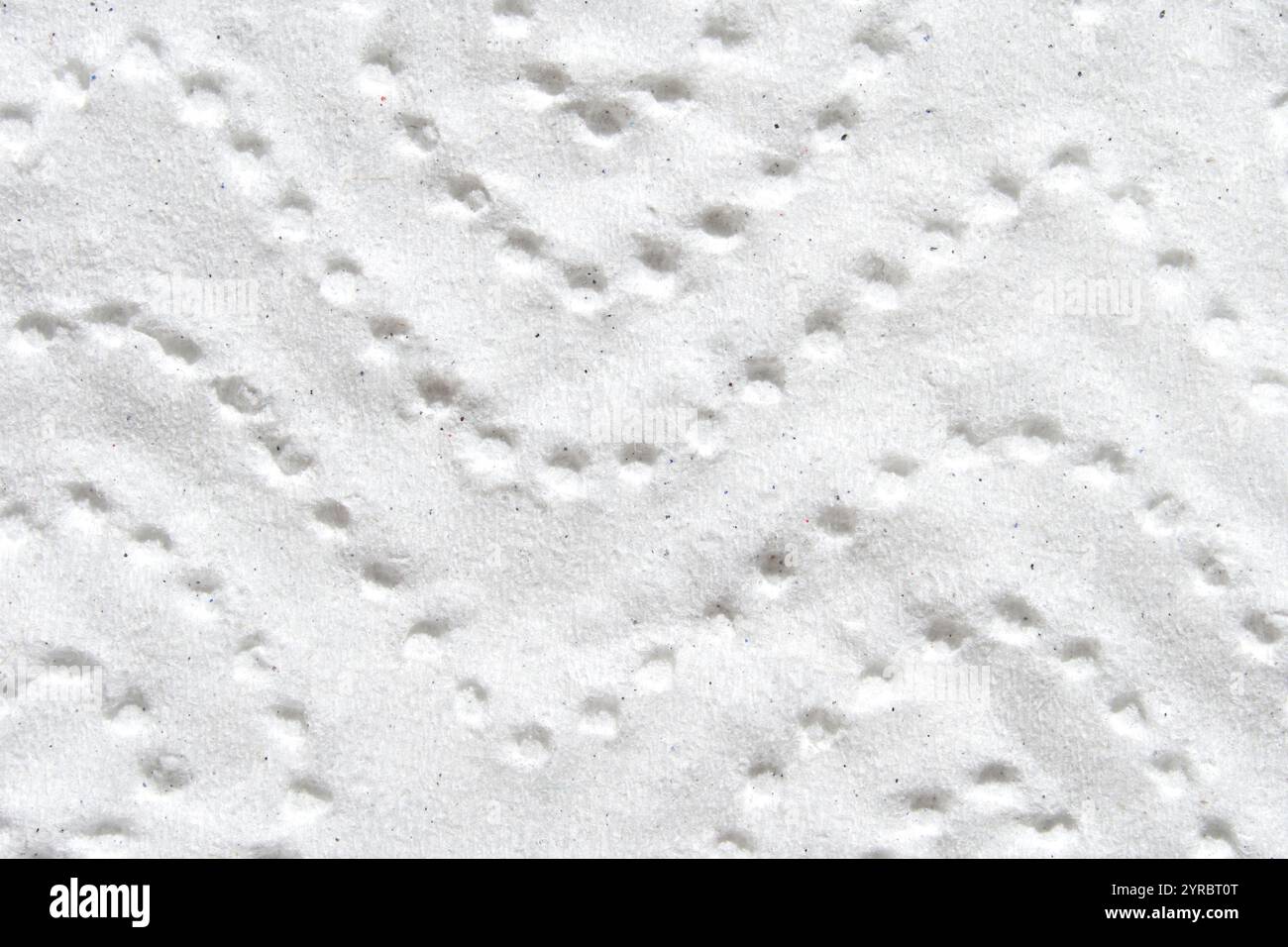 Abstract close up of white textured patterned surface with circular ...