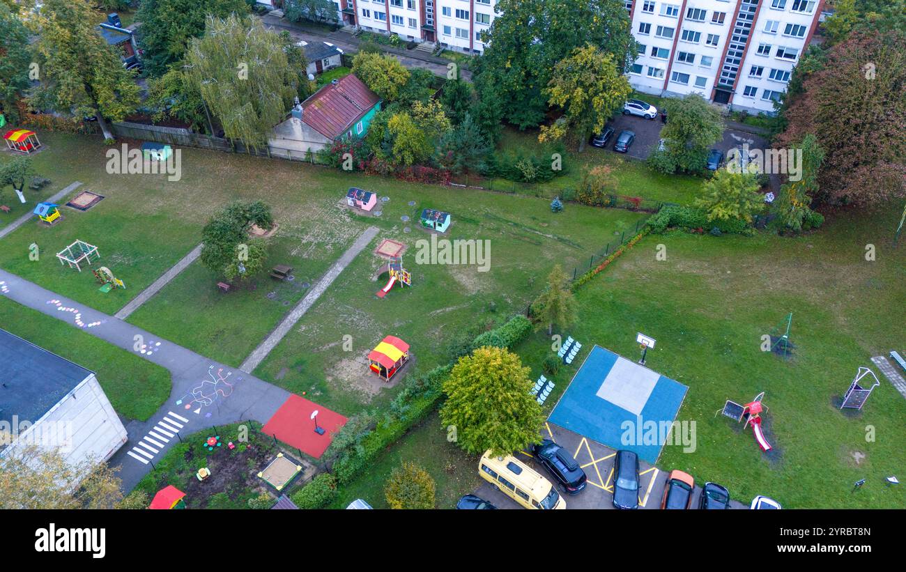 Aerial view of a park with playground equipment, grassy areas, and ...