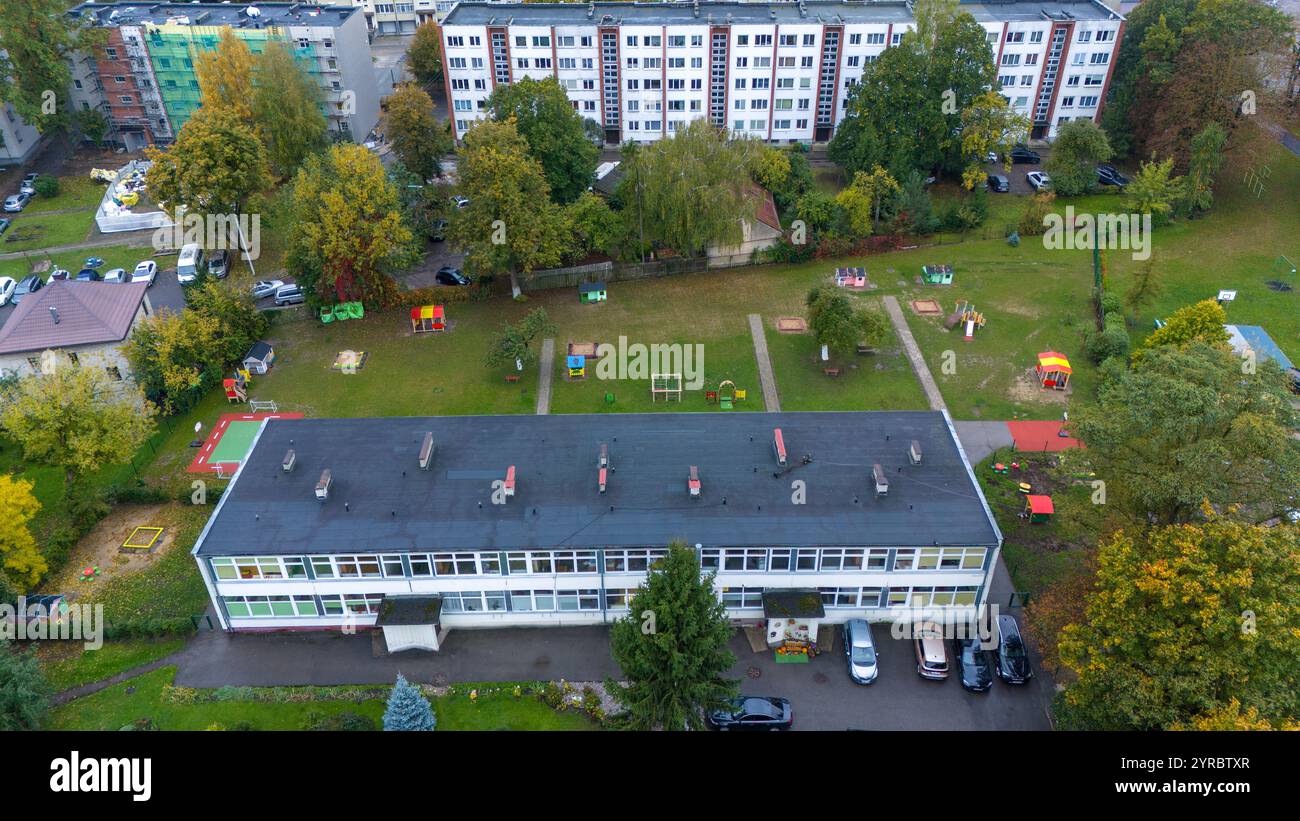Aerial view of a school building with a playground and surrounding ...