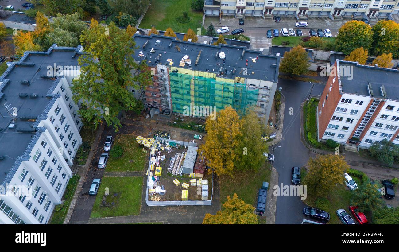 Aerial view of a construction site in a residential area, showing a ...