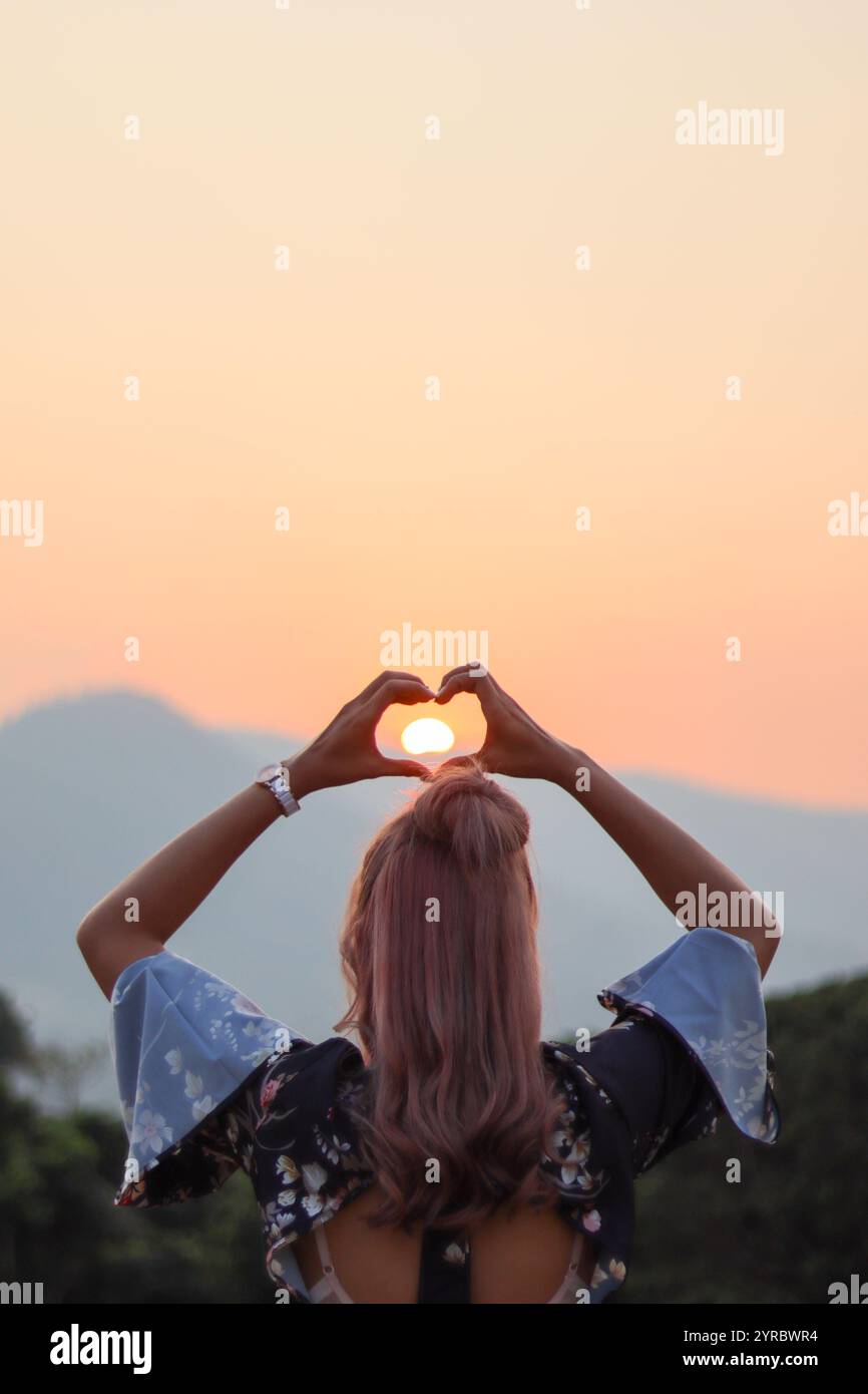 Beautiful girl show love sign hi-res stock photography and images - Alamy