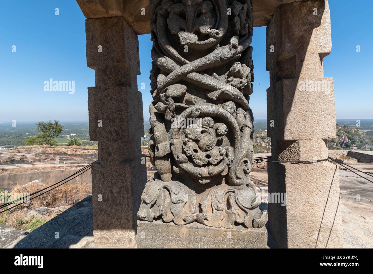 A detailed stone sculpture of a mythological figure with multiple heads ...