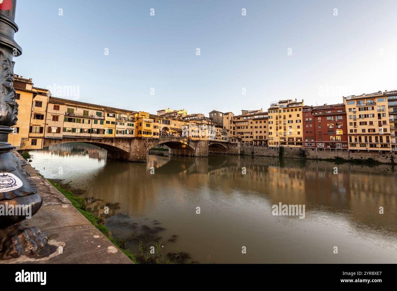 Picturesque medieval arched river bridge with Roman origins, lined with ...