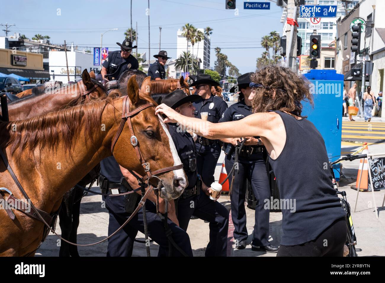 Los Angeles, USA. 4th Jul, 2024. Man petting a LAPD Horse on Venice ...