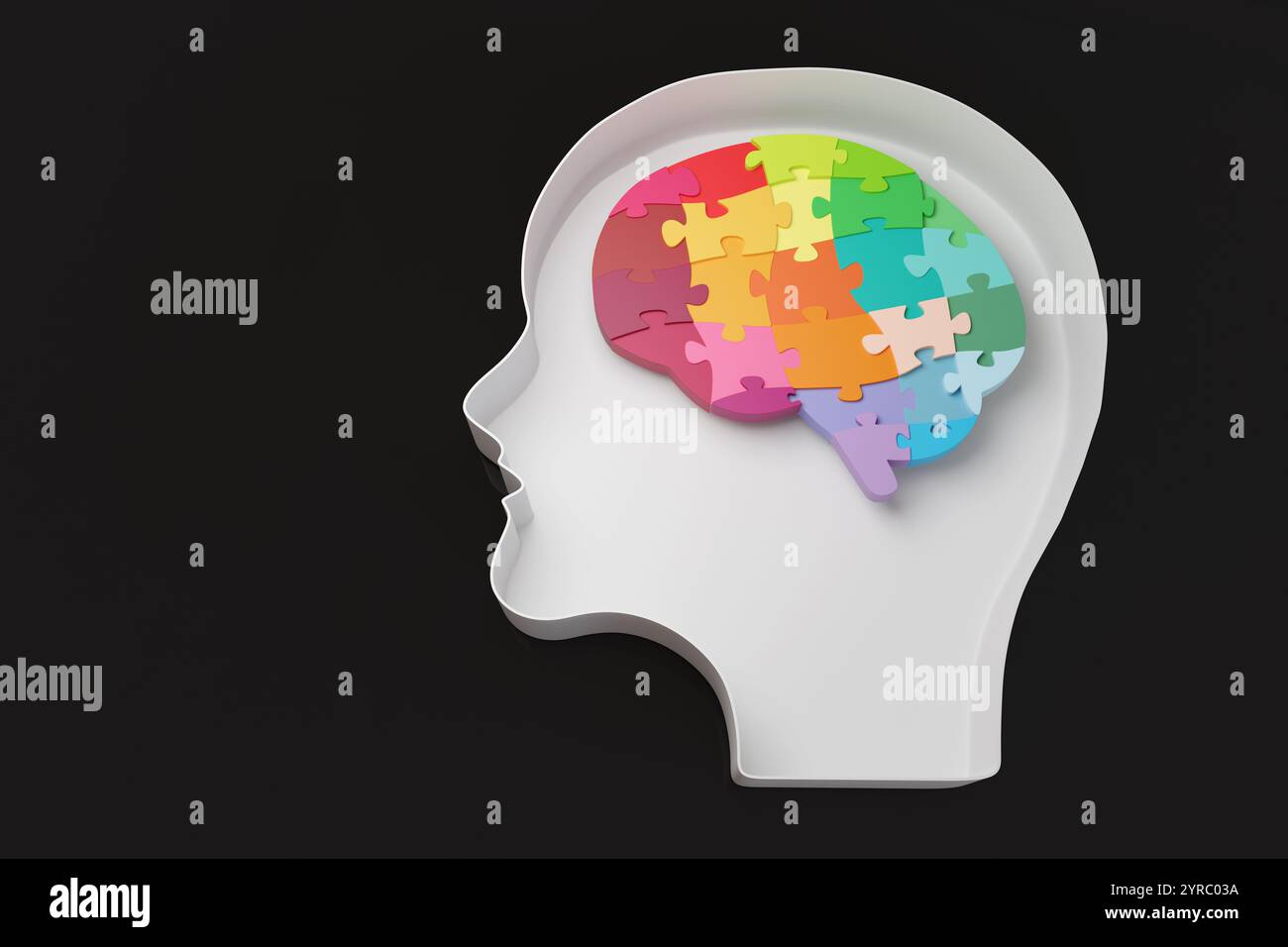 Multi-colored brain jigsaw puzzle in a human head shaped container on ...