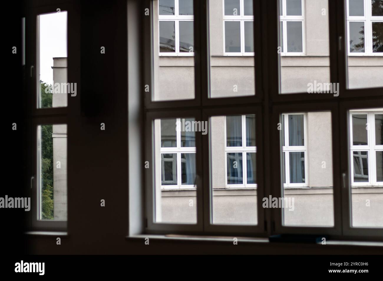 A view through a window showing another building with symmetrical ...