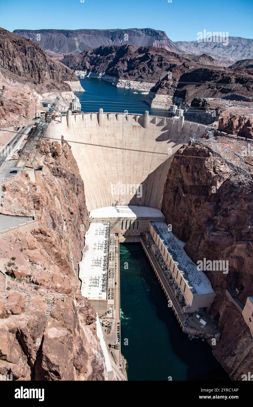 Aerial view of Hoover Dam, Colorado River, and surrounding rugged ...