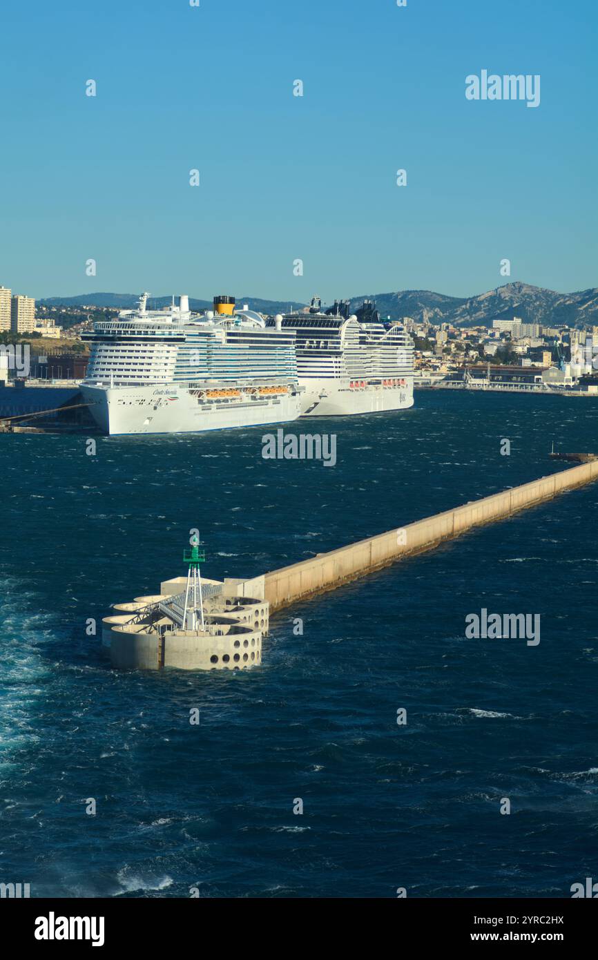 Marseille, France - December 03, 2024: Concrete wave breaker with ...