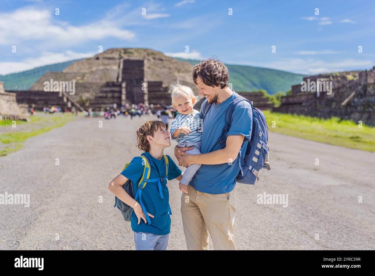 Father with his toddler and teenage sons exploring Teotihuacan, Mexico ...