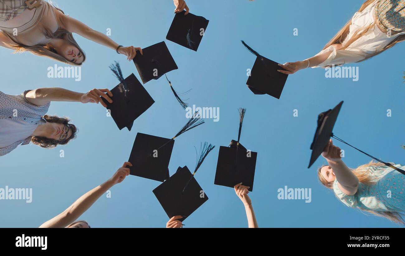 Group of recent graduates are celebrating their accomplishment by ...