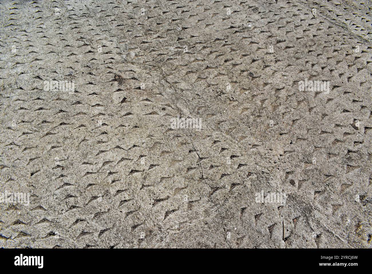 Surface floor with spiked cement to prevent slipping Stock Photo - Alamy