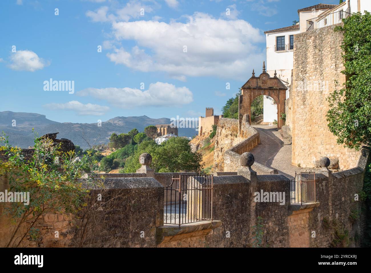 Felipe V Arch, city walls, and the Church of the Holy Spirit in Ronda ...