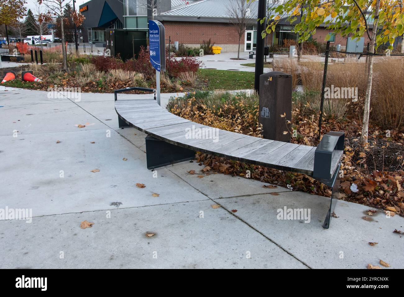 Curved wooden bench at Town Square park on Innisfil Beach Road in ...