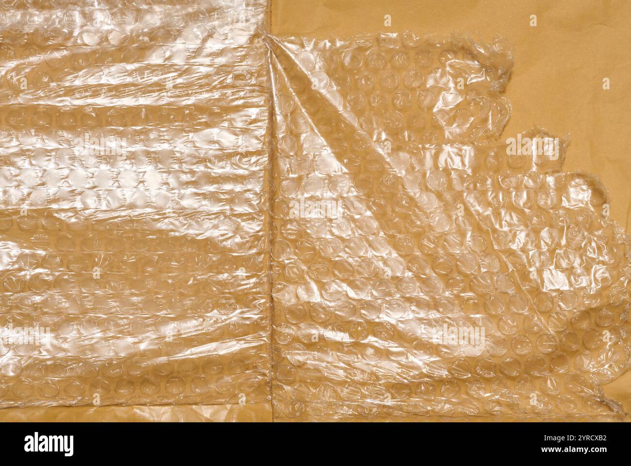 Texture of yellow paper with film and air bubbles, packaging material ...